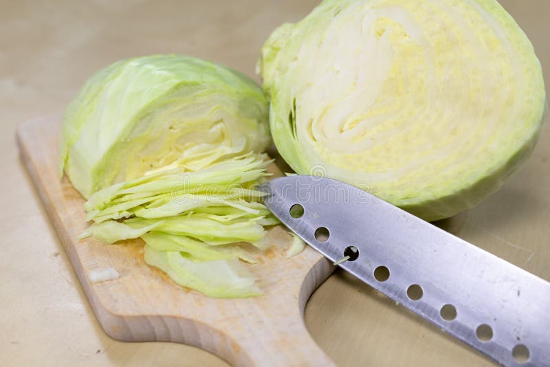 Fresh White Cabbage Cut into Strips on the Kitchen Table. Vegetables ...
