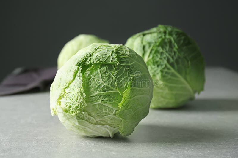 Fresh Whole Cabbage on Grey Table Stock Photo - Image of black, dark ...