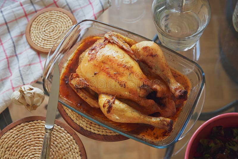 Fresh Whole Roasted Chicken with Garlic in Glass Form for Baking Stock ...