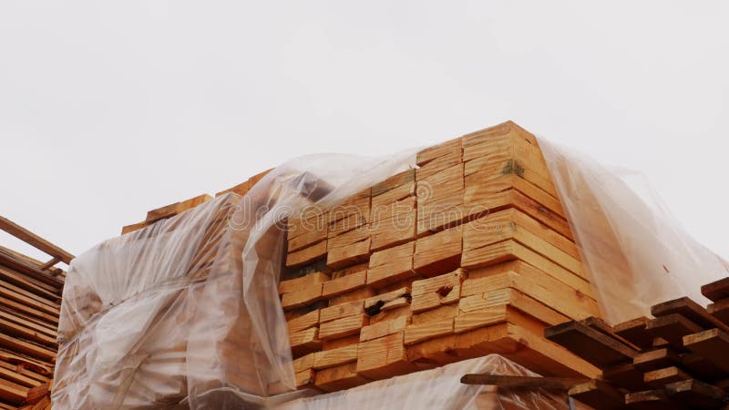 Fresh Wooden Boards in Polypropylene Packaging on Background of Cloudy ...