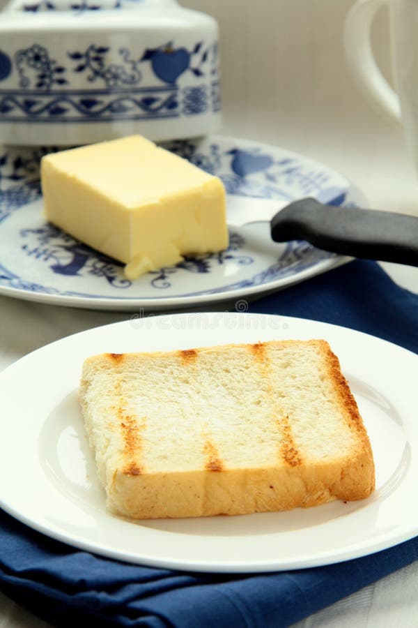 Fresh Yellow Butter on Toast Stock Image - Image of plate, crust: 17556913