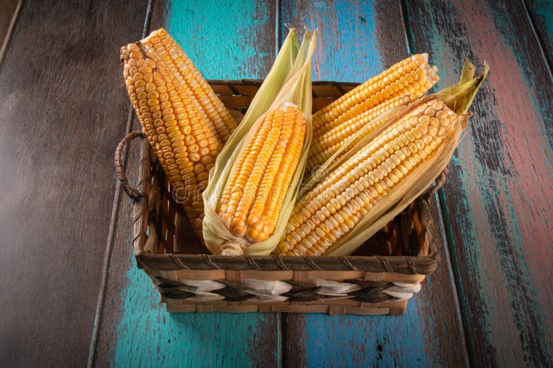 Fresh Yellow Corn in Basket Over Rustic Wood Stock Photo - Image of ...