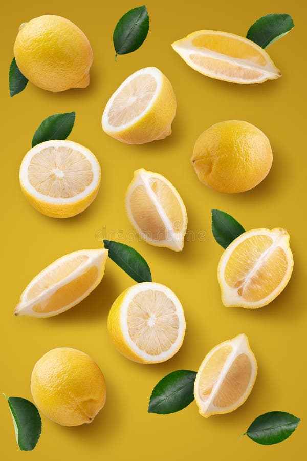 Fresh Yellow Lemon and Yellow Lemon Slices on a Yellow Background ...