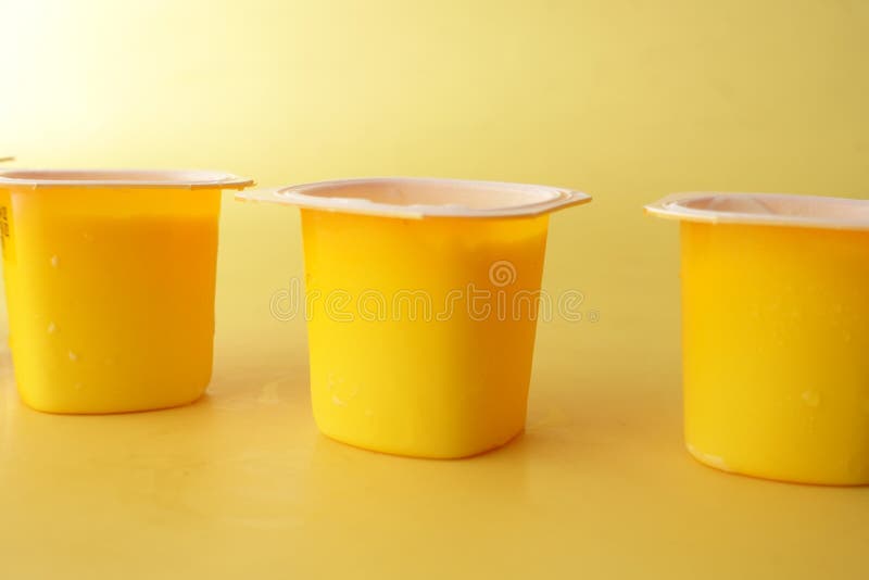 Fresh Yogurt in a Yellow Color Plastic Container Stock Image - Image of ...