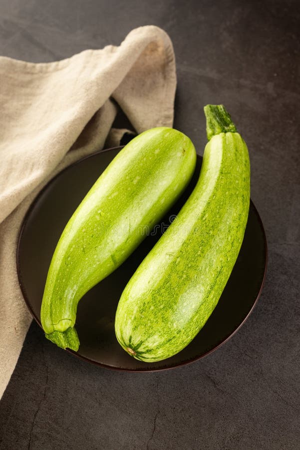 Fresh Young Zucchini on Dark Table - Harvest Stock Photo - Image of ...