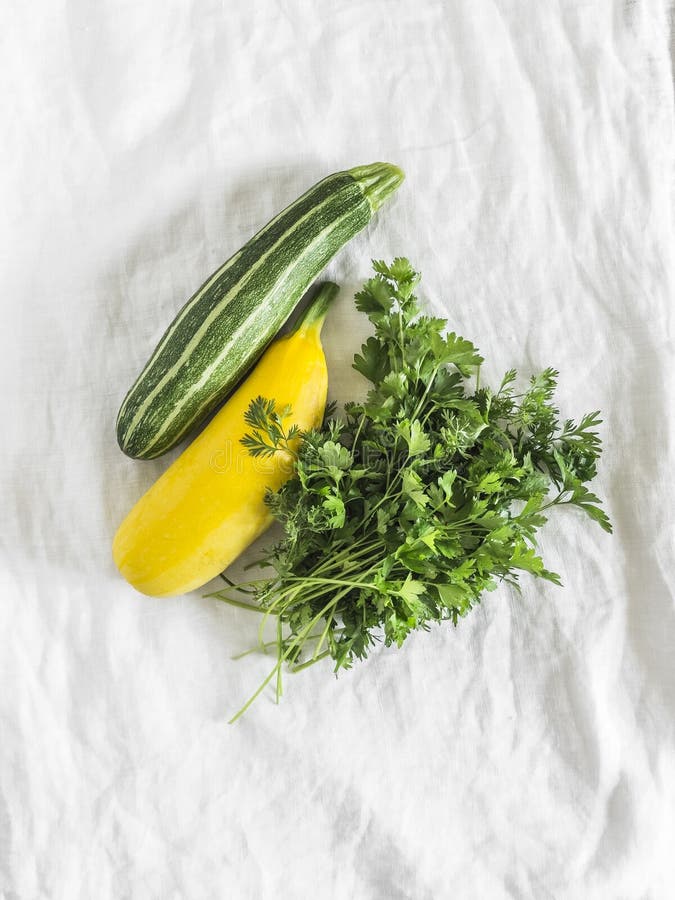 Fresh Zucchini and Coriander on a Light Surface, Top View Stock Photo ...