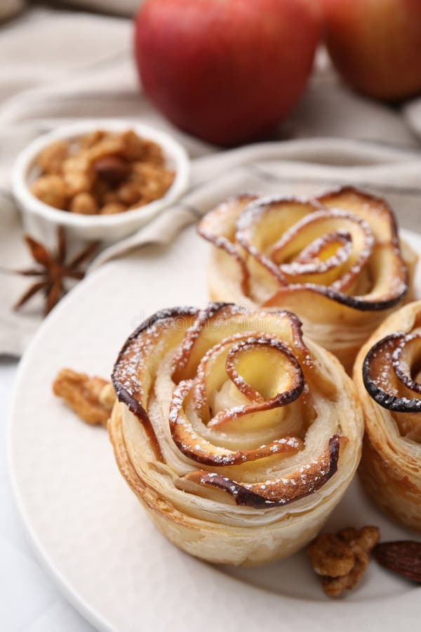 Freshly Baked Apple Roses and Walnuts on Table, Closeup. Puff Pastry ...