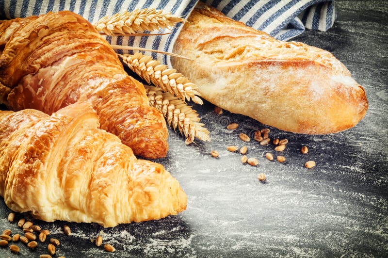 Freshly Baked Baguette and Croissants in Rustic Setting Stock Photo ...