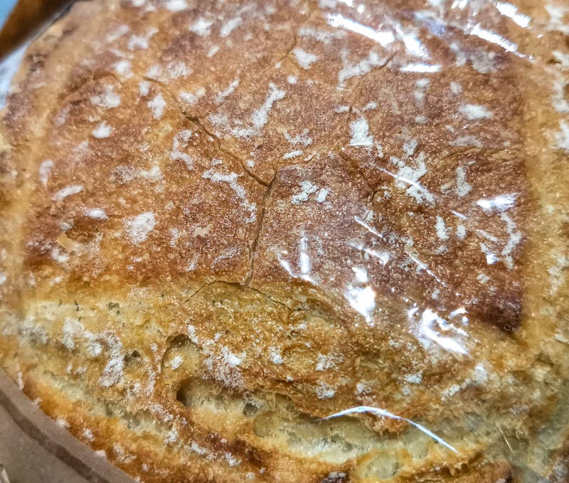 Freshly Baked Bread Close-up Packed in Polyethylene Packaging Stock ...