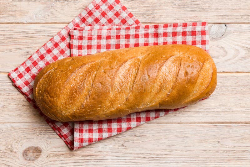 Freshly Baked Bread with Napkin on Rustic Table Top View. Healthy White ...