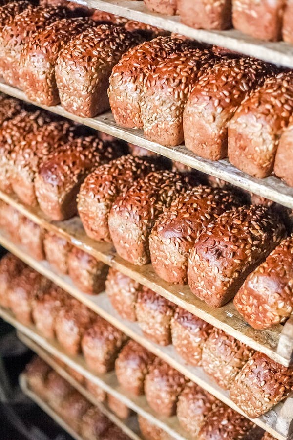 Freshly Baked Bread Stacked And Ready For Packaging At Factory Stock ...