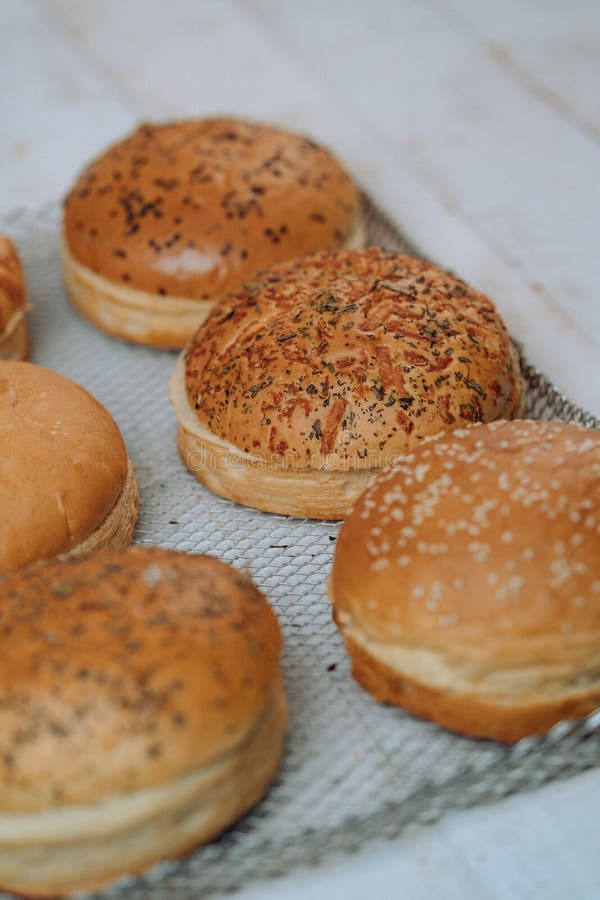 Freshly baked burger buns stock photo. Image of baked - 258554856