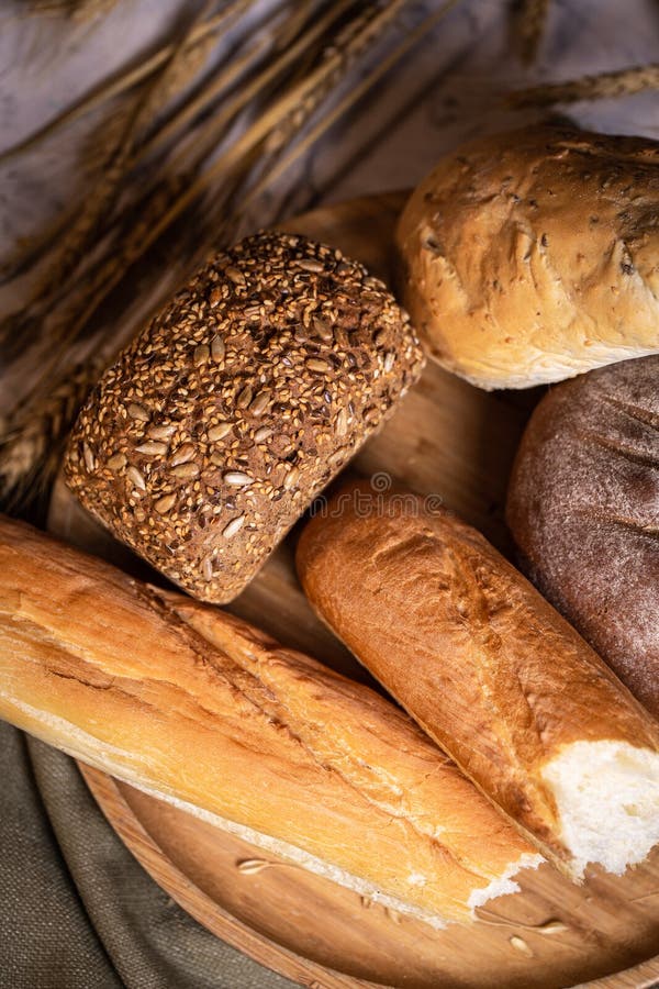 Freshly Baked Crusty Bread and Buns with Wheat Ears Top View Stock ...