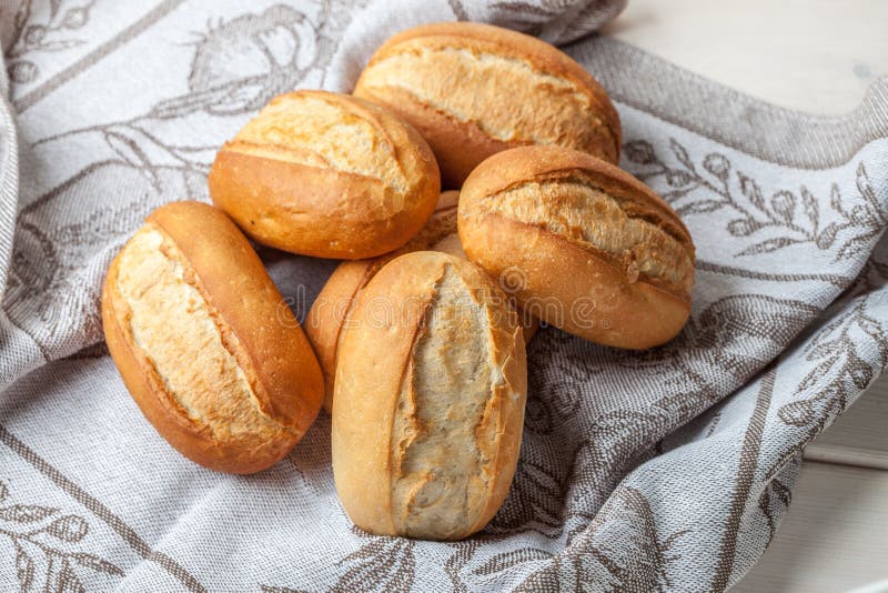 Freshly baked crusty rolls stock image. Image of plate - 74300341