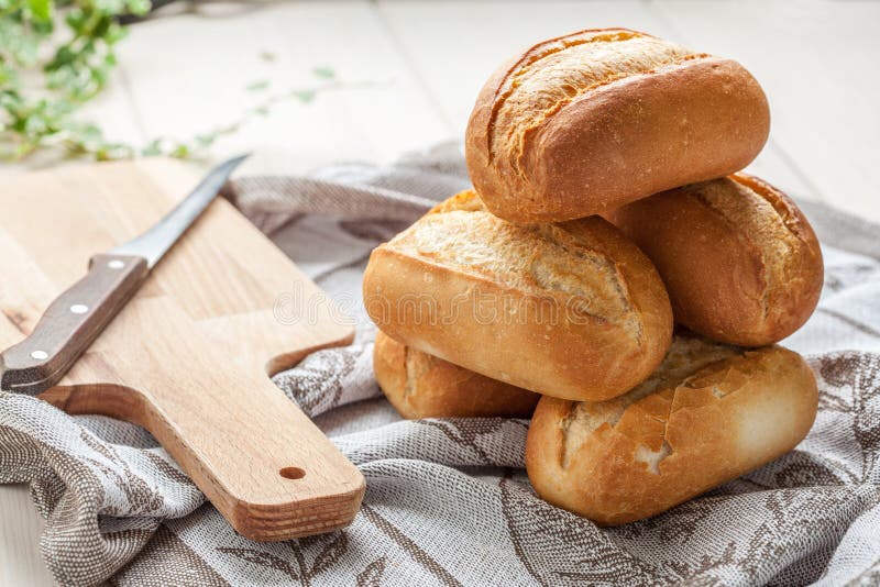Freshly baked crusty rolls stock image. Image of planks - 74301219