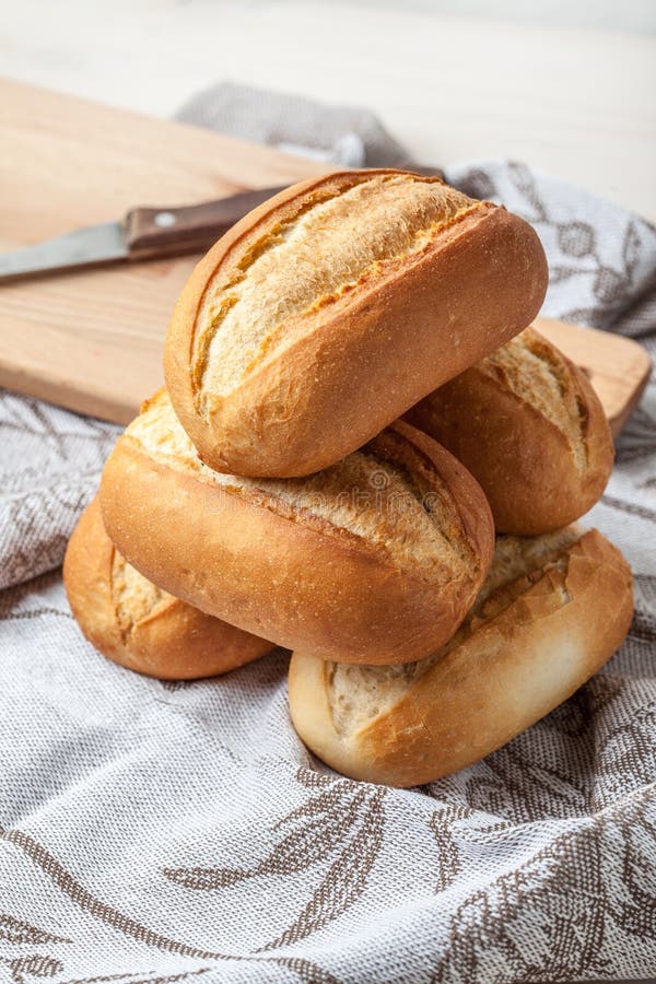 Freshly baked crusty rolls stock image. Image of baking - 74301339