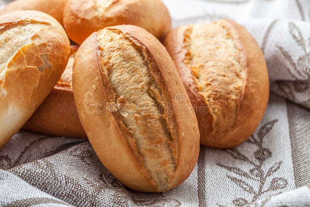 Freshly baked crusty rolls stock image. Image of roll - 79160747