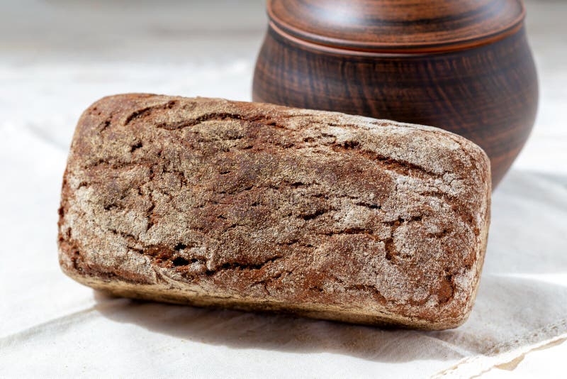 Freshly Baked Fragrant Bread Leaning on a Pot on a White Background ...