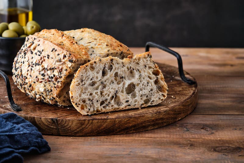 Freshly Baked Multigrain Bread on Rustic Background. Stock Photo ...