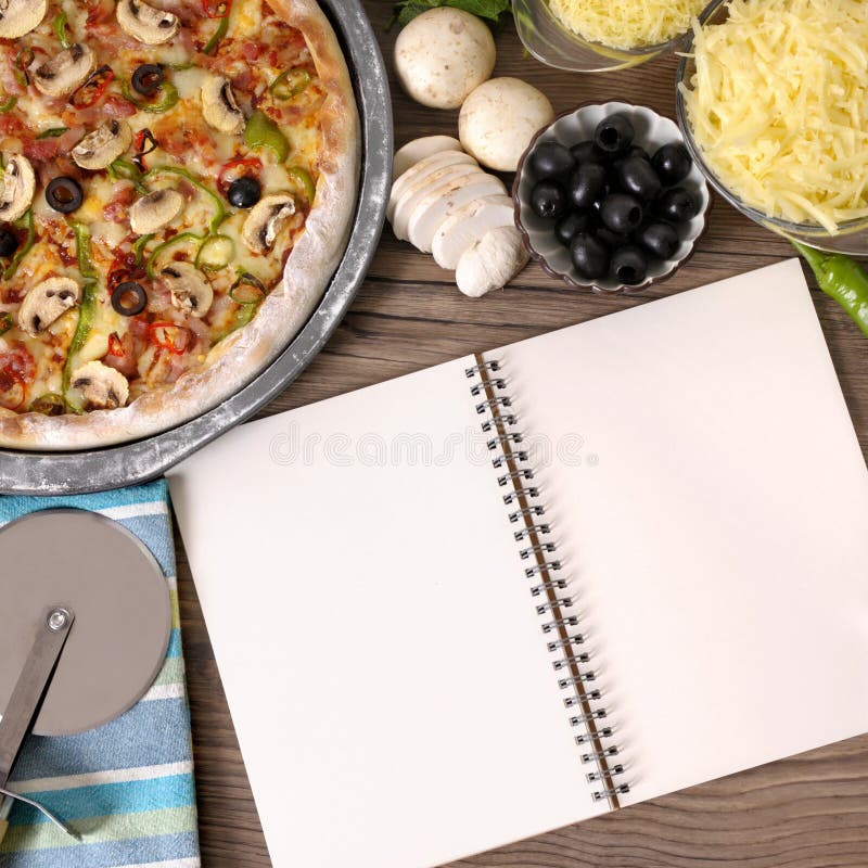Freshly Baked Pizza with Cookbook Stock Photo - Image of worktop ...