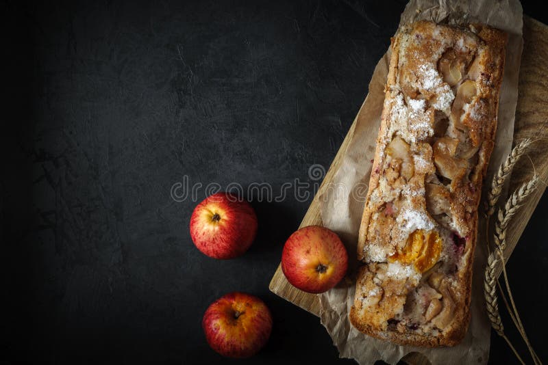Freshly Baked Rectangular Apple Cake with Whole Apples and Ears on ...