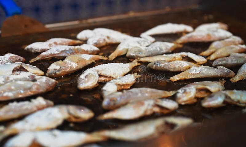 Freshly Battered Fish Frying Stock Photo - Image of culinary ...