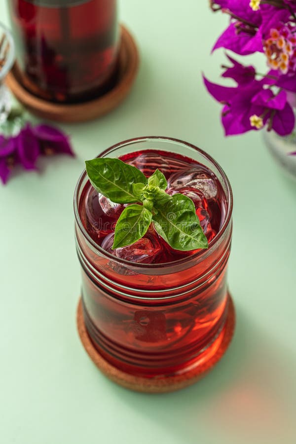 Freshly Brewed Iced Red Fruit Tea on Green Table Stock Image - Image of ...