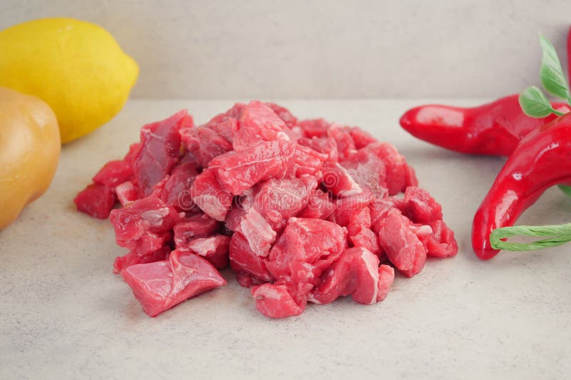 Freshly Chopped Beef Cubes Surrounded by Vegetables on a Countertop ...