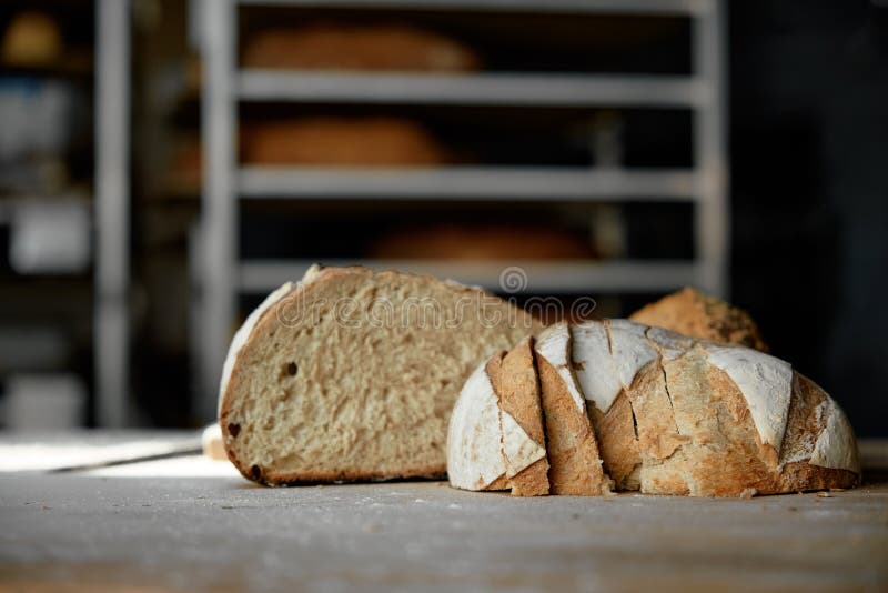 Freshly Cooked Artisan Bread Half and Sliced on Table Bakery Shop Stock ...