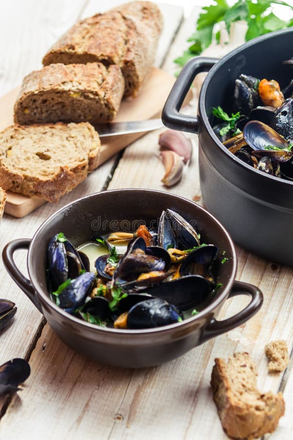 Freshly Cooked Mussels at Home and Served with Bread Stock Photo ...