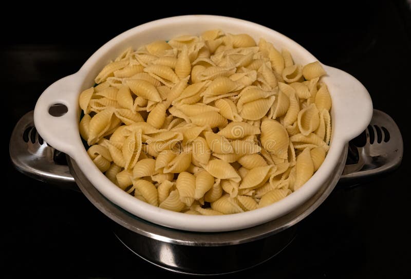Freshly Cooked Pasta Shells in a Colander Stock Photo - Image of ...