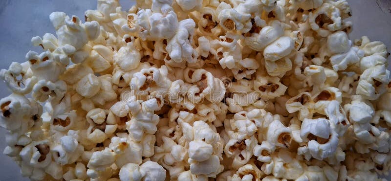 This is Freshly Cooked Popcorn in a Plastic Container that Looks ...