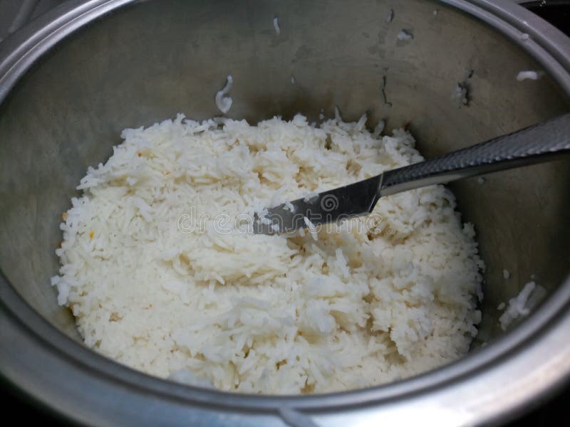 Large Silver Pot of Rice with a Silver Knife Stock Photo - Image of ...