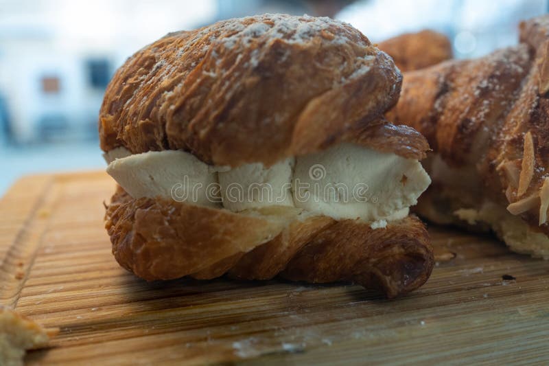 Freshly Cut Croissant Sandwich is Displayed on a Cutting Board Stock ...