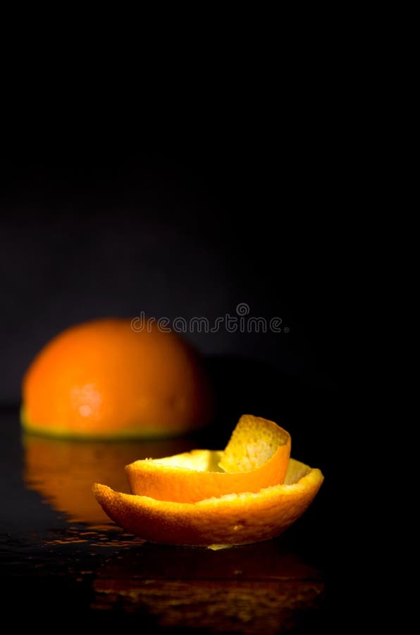 Freshly Cut Orange Peel and Orange on Dark Wet Background Stock Image ...