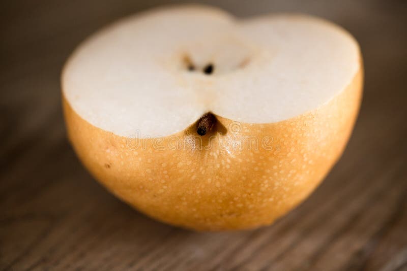 Freshly cut pear half stock photo. Image of plate, fruit - 105430644