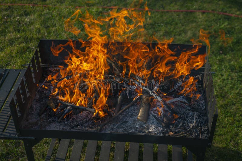 Freshly lit barbecue fire stock photo. Image of fire - 169609136