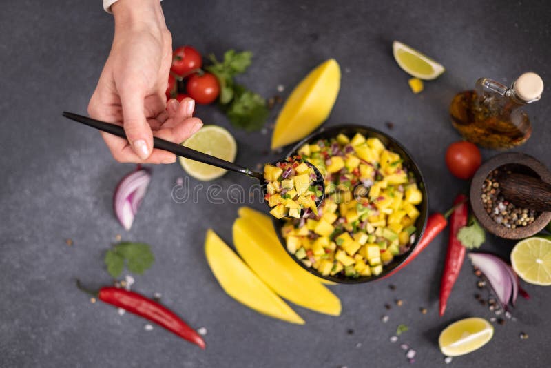 Freshly Made Mango Salsa in a Black Ceramic Bowl on a Table with ...