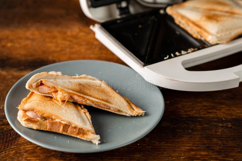 Freshly Made Toasted Sandwiches from a Sandwich Maker on a Plate on a ...