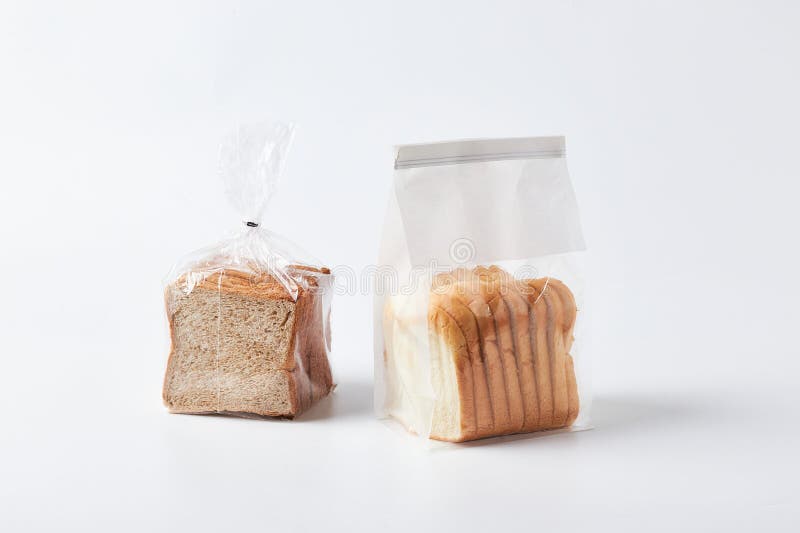 Freshly Packaged Whole Grain and White Bread Loaves on a Plain ...