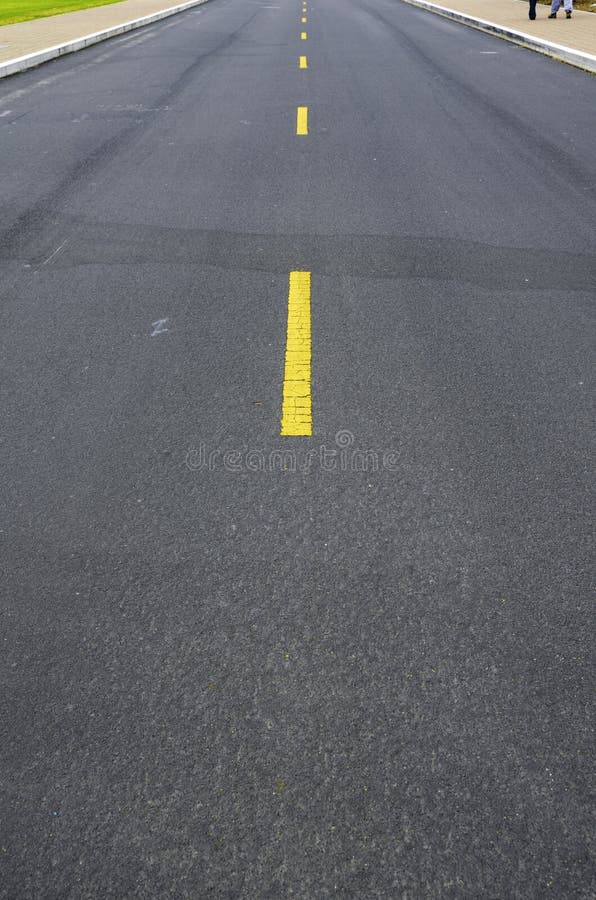 A Freshly Paved Asphalt Road with a Smooth, Dark Surface Features a ...