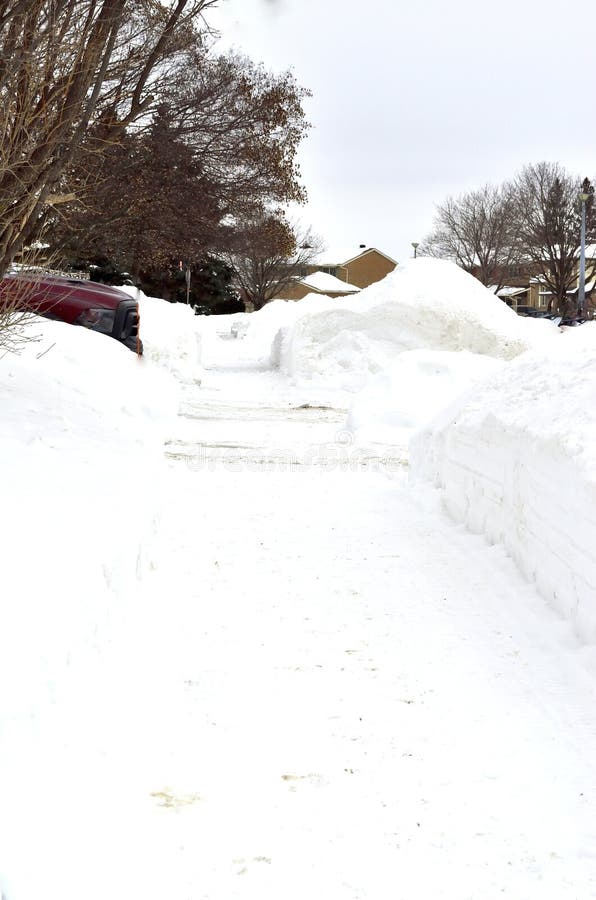 Freshly Plowed Sidewalk with Deep Snow on All Sides Stock Image - Image ...