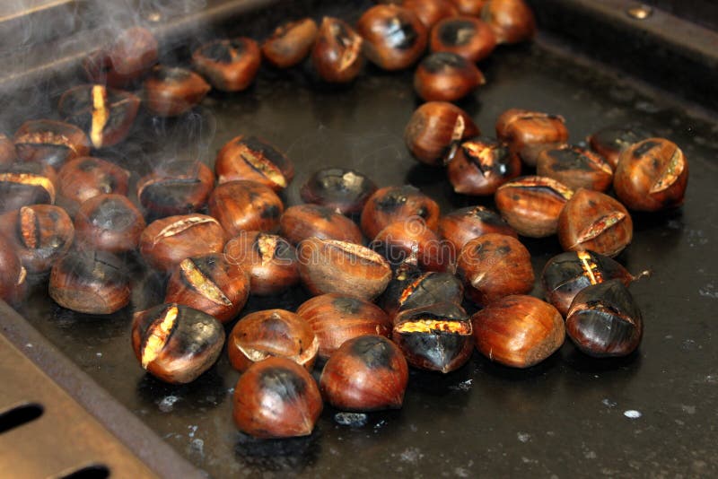 Freshly roasted chestnuts stock photo. Image of food - 136418544