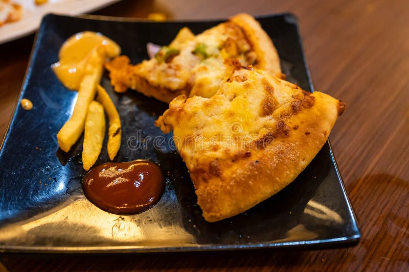 Freshly Served Pizza Slice with Red Sauce on Plate in Indoor Stock ...