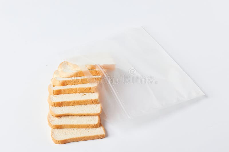 Sliced Bread Being Stored in a Clear Plastic Bag on a White Surface ...