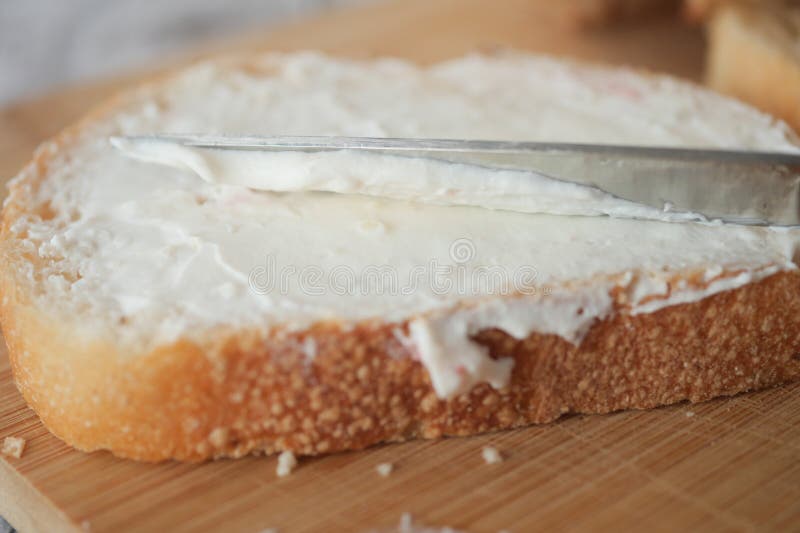 Freshly Spread Butter on a Slice of Bread in a Cozy Kitchen Stock Image ...