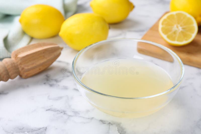 Freshly Squeezed Lemon Juice on White Table Stock Image - Image of ...