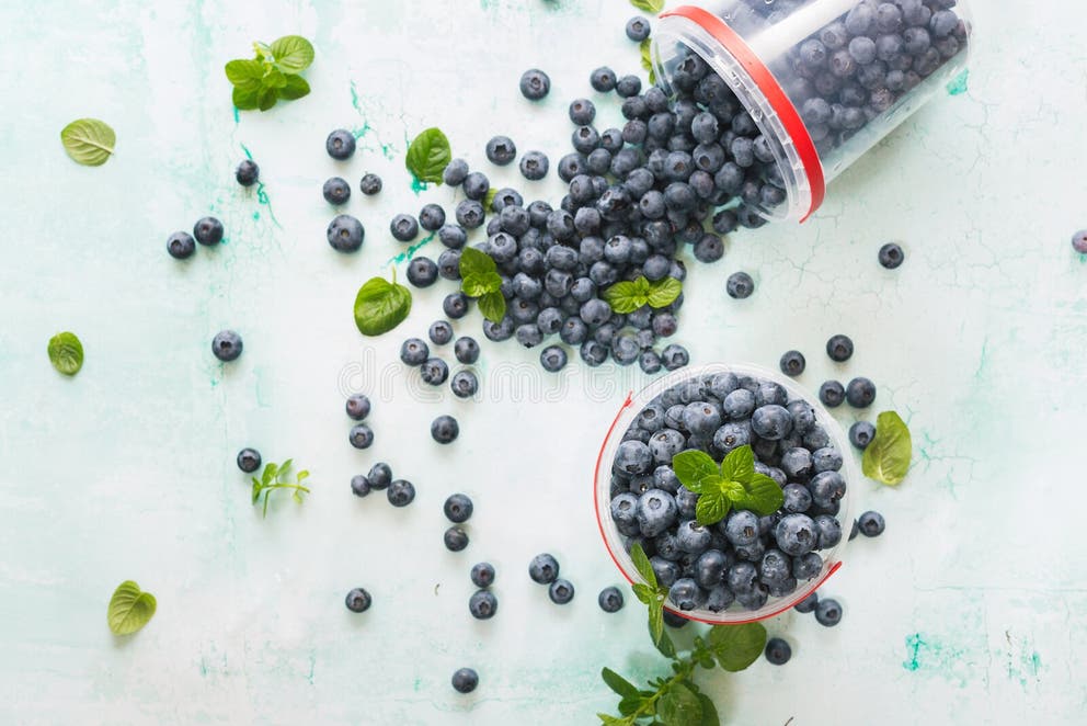 Freshly Washed Blueberries with Plastic Beaker on Rustic Surface Stock ...