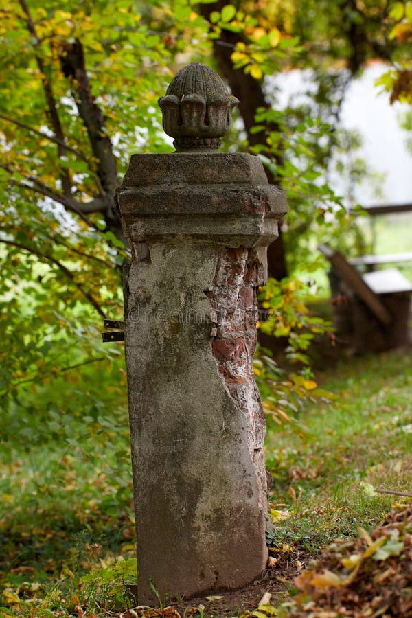Fretwork on Column in Red Bricks Garden with Tall Poplar Trees ...