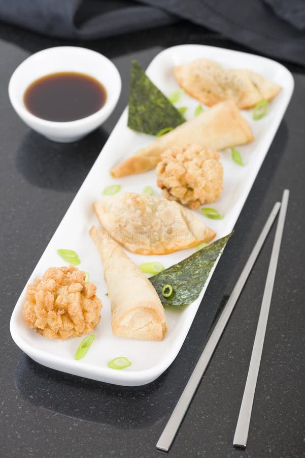 Fried Asian Snacks stock image. Image of black, chopsticks - 50525631